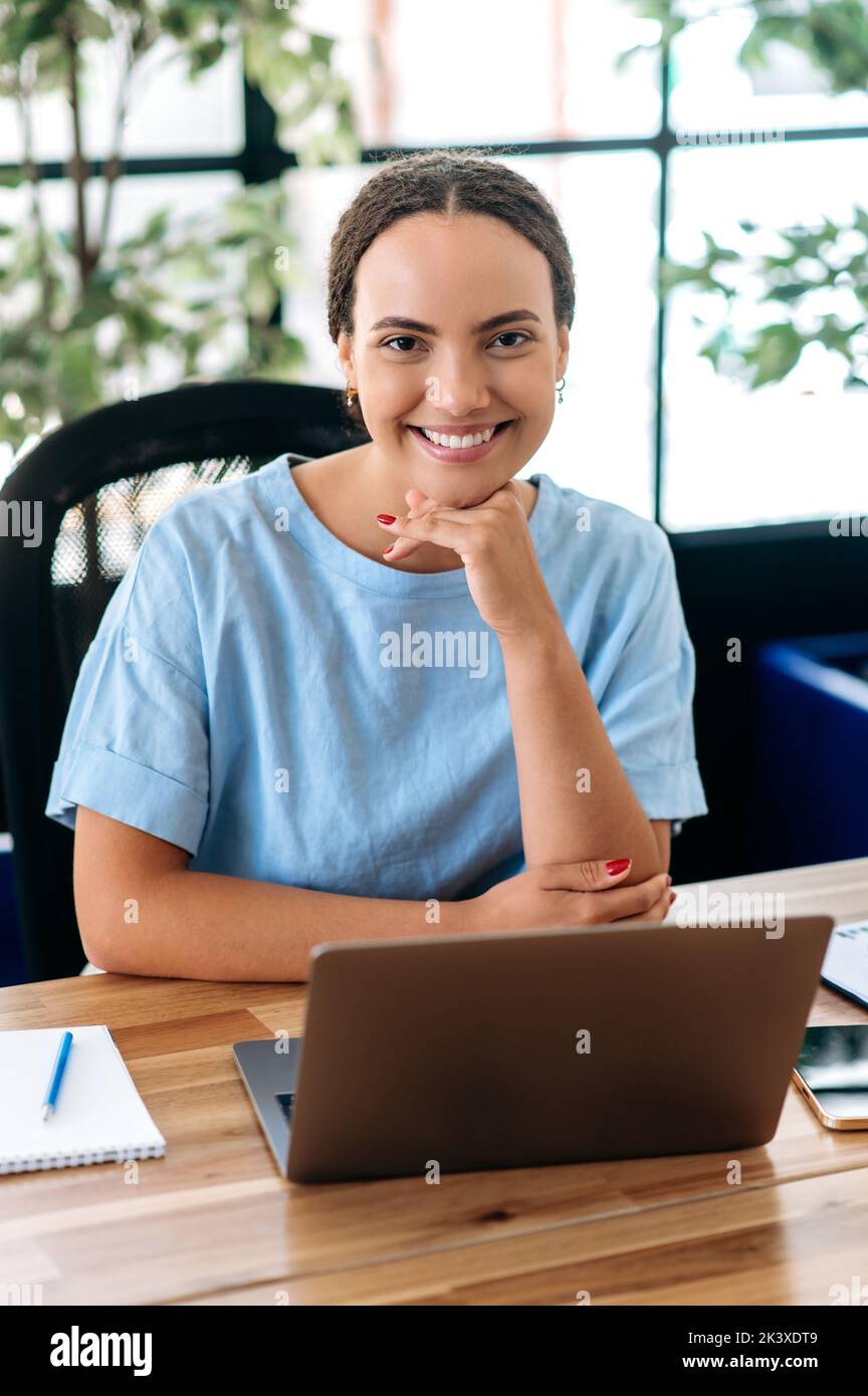 Portrait of a beautiful positive friendly hispanic or brazilian young ...