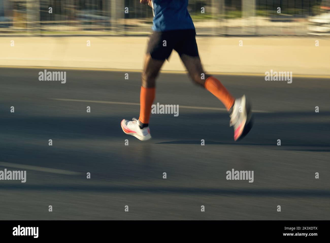 Close up shot feet of the Competitors running in the half marathon are ...
