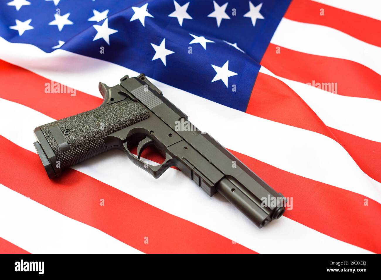 Gun over American patriotic flag, firearms restriction debate Stock ...