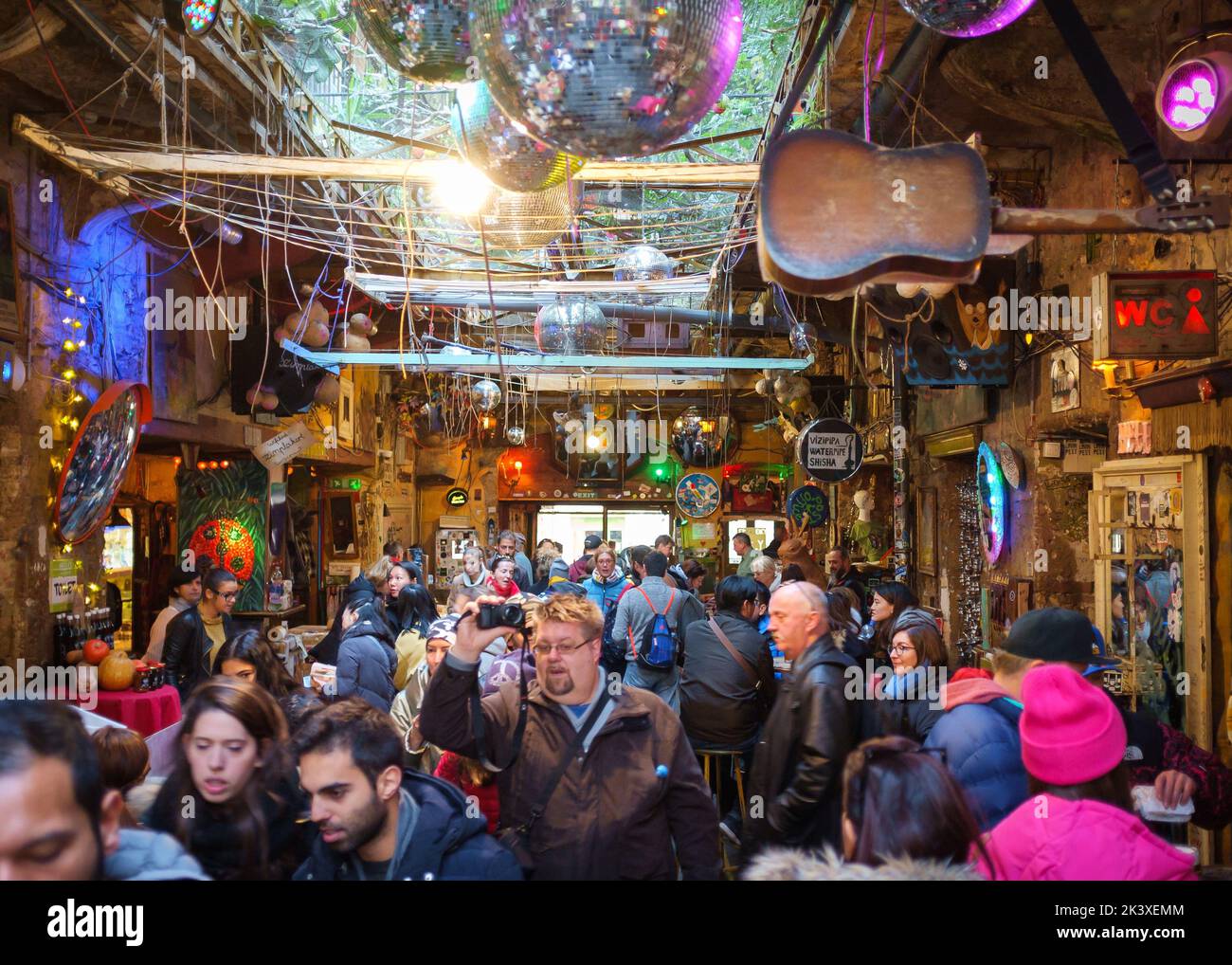 A closeup of people at Szimpla Kert Ruin Bar in Budapest Stock Photo ...