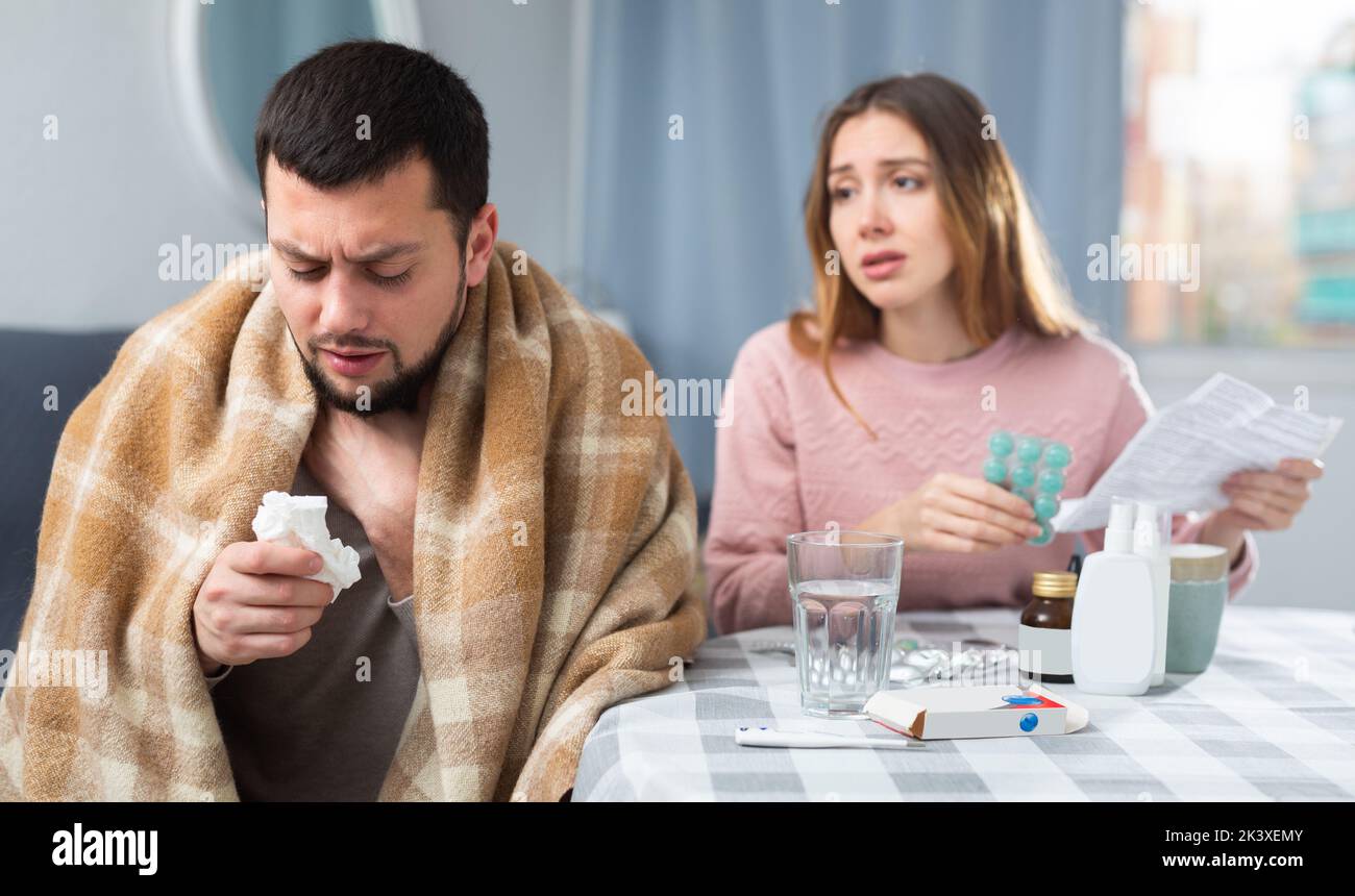 Woman comfort man sneezing hi-res stock photography and images - Alamy