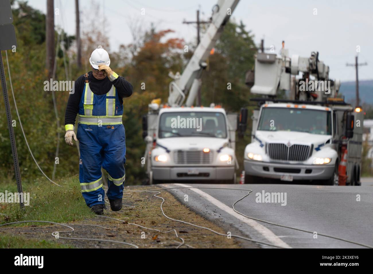 Power crews work to fix power lines near Lower Barneys River in Pictou County, N.S. on Wednesday ...