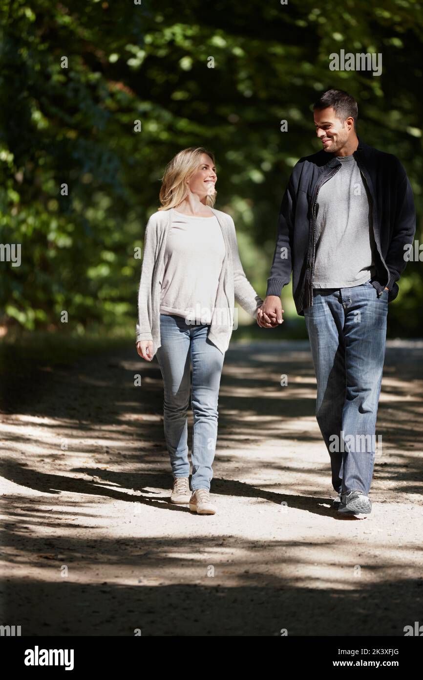 Couple lovingly holding hands hi-res stock photography and images - Alamy