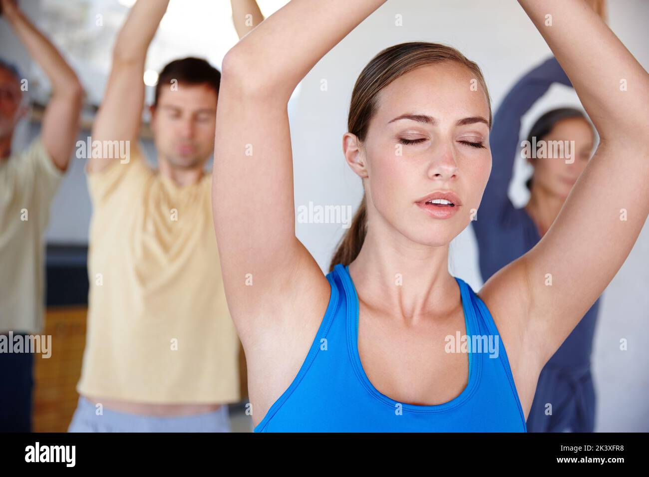 Breathing out all of their worries and cares. A cropped shot of a relaxed family exhaling while ...