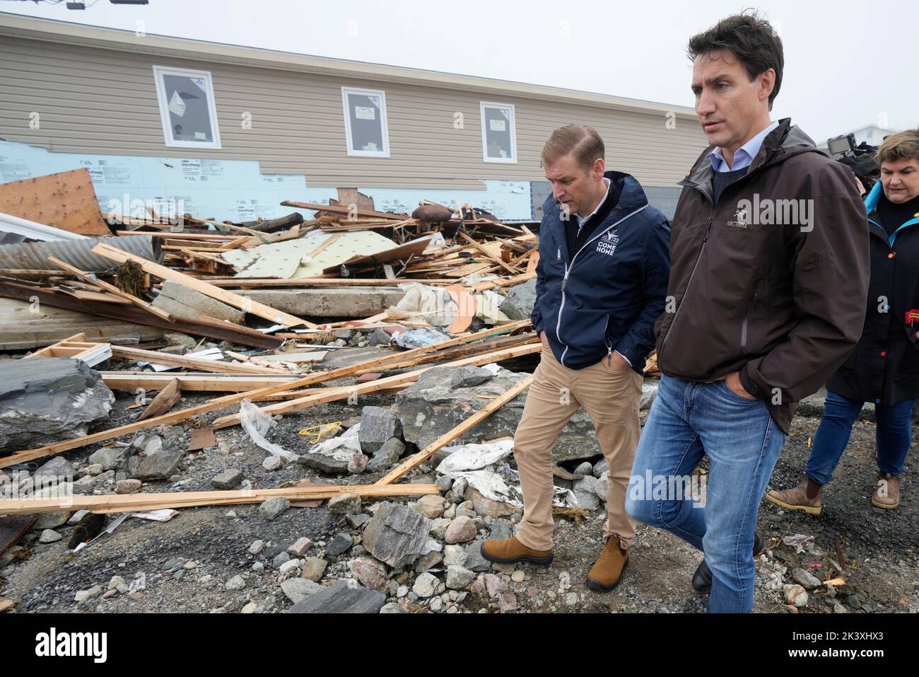 Prime Minister Justin Trudeau, right, and Premier Andrew Furey tour the damage cause by post ...
