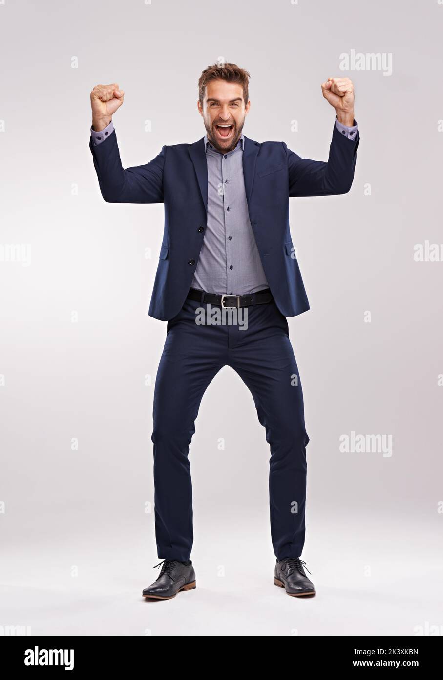 Oh yeah. Portrait of a handsome businessman celebrating a victory Stock ...