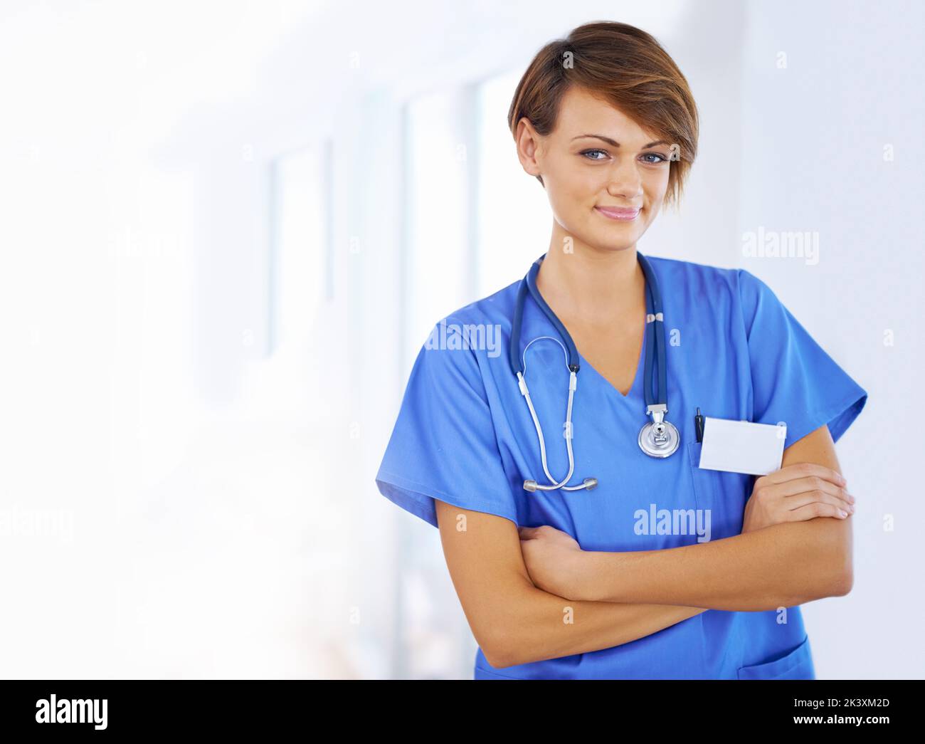 Tell me where it hurts. Portrait of a confident young doctor wearing ...