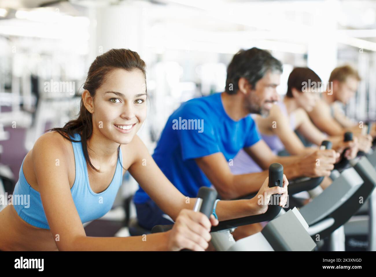 Feeling good during the warm up. a row of people working out on the ...
