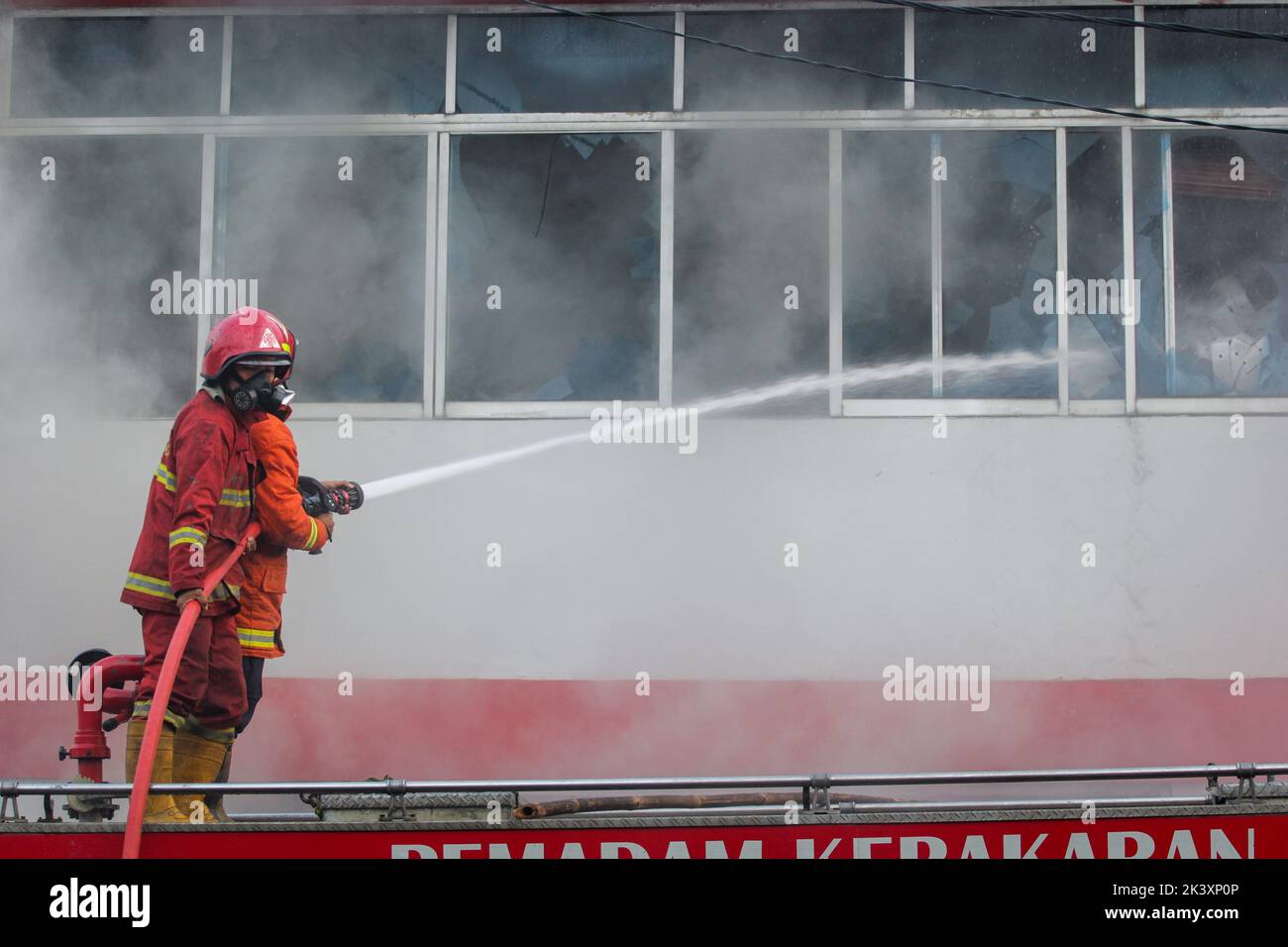 A closeup of a firefighter extinguishing the fire of the Padang ...