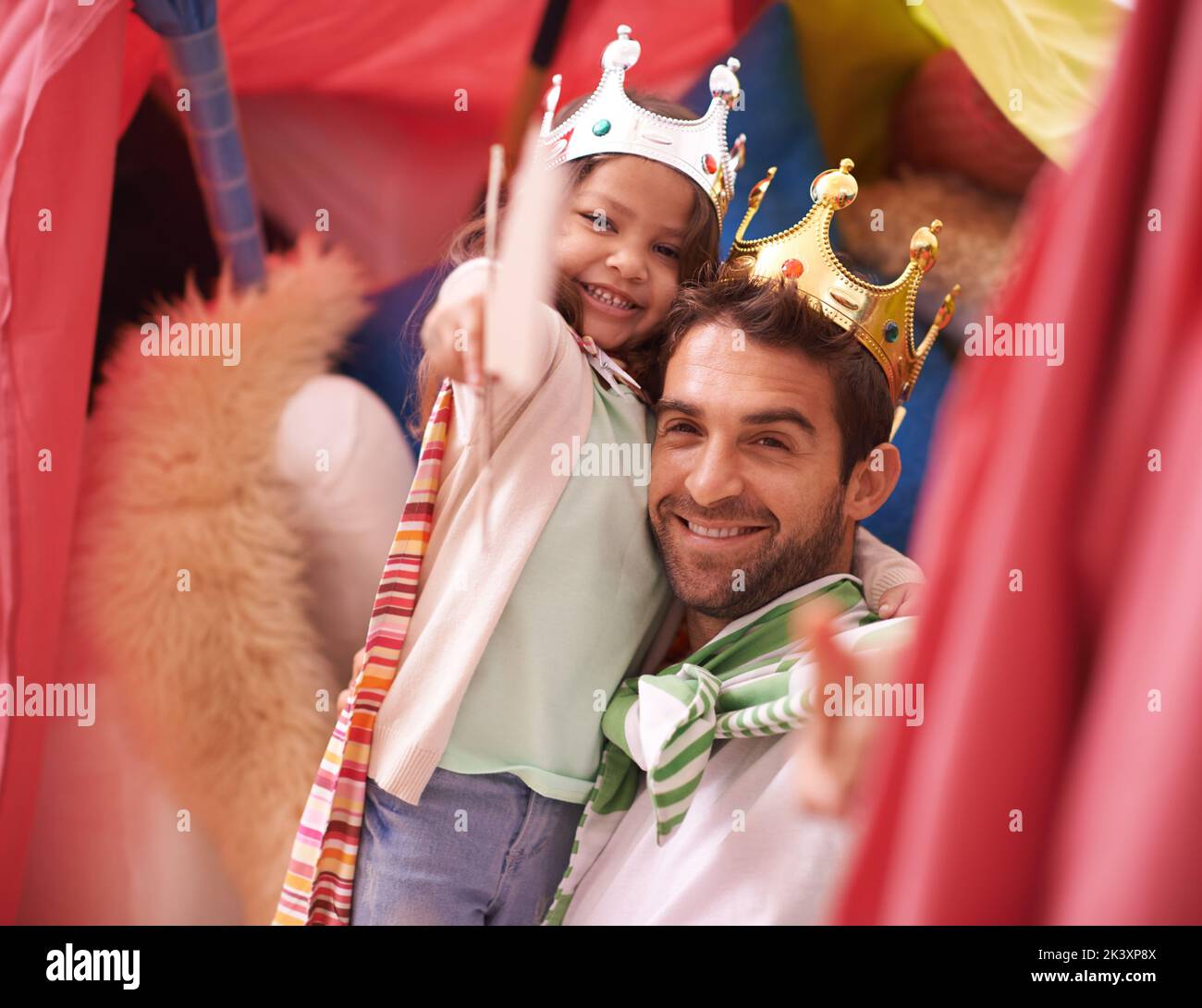 Having so much fun. A cute little girl dressed up as a princess while ...