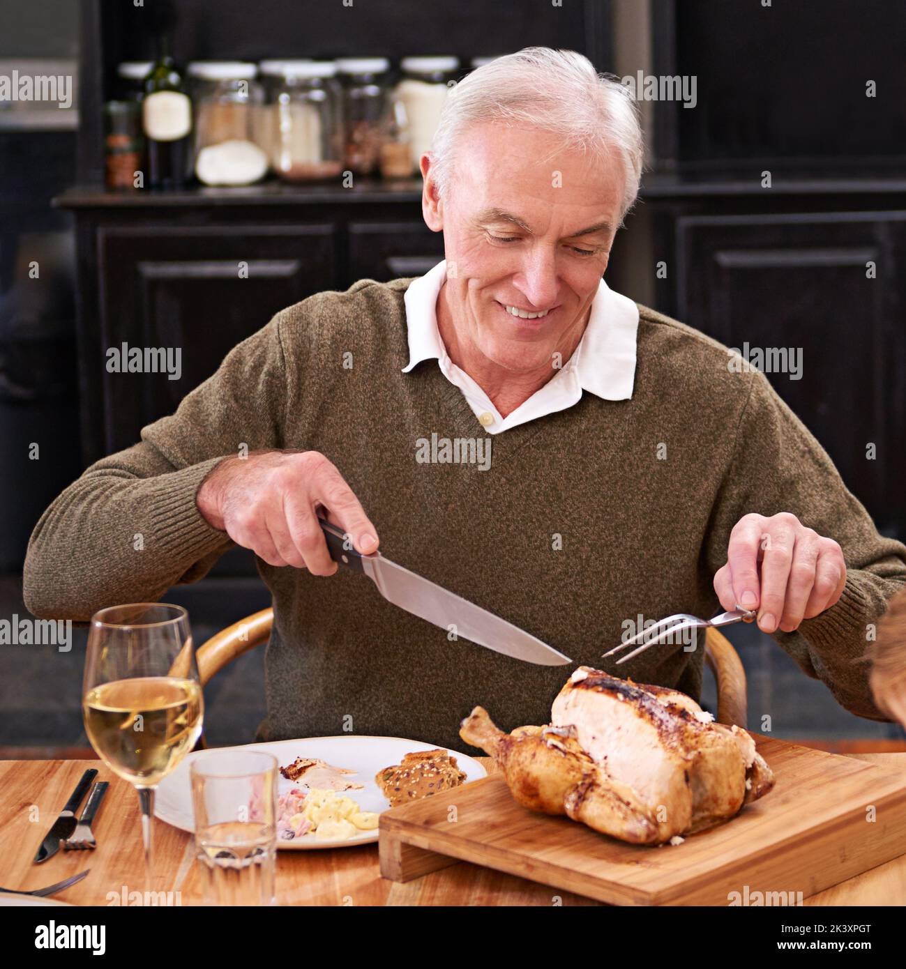 The first piece is mine. a senior man enjoying some roast chicken at ...