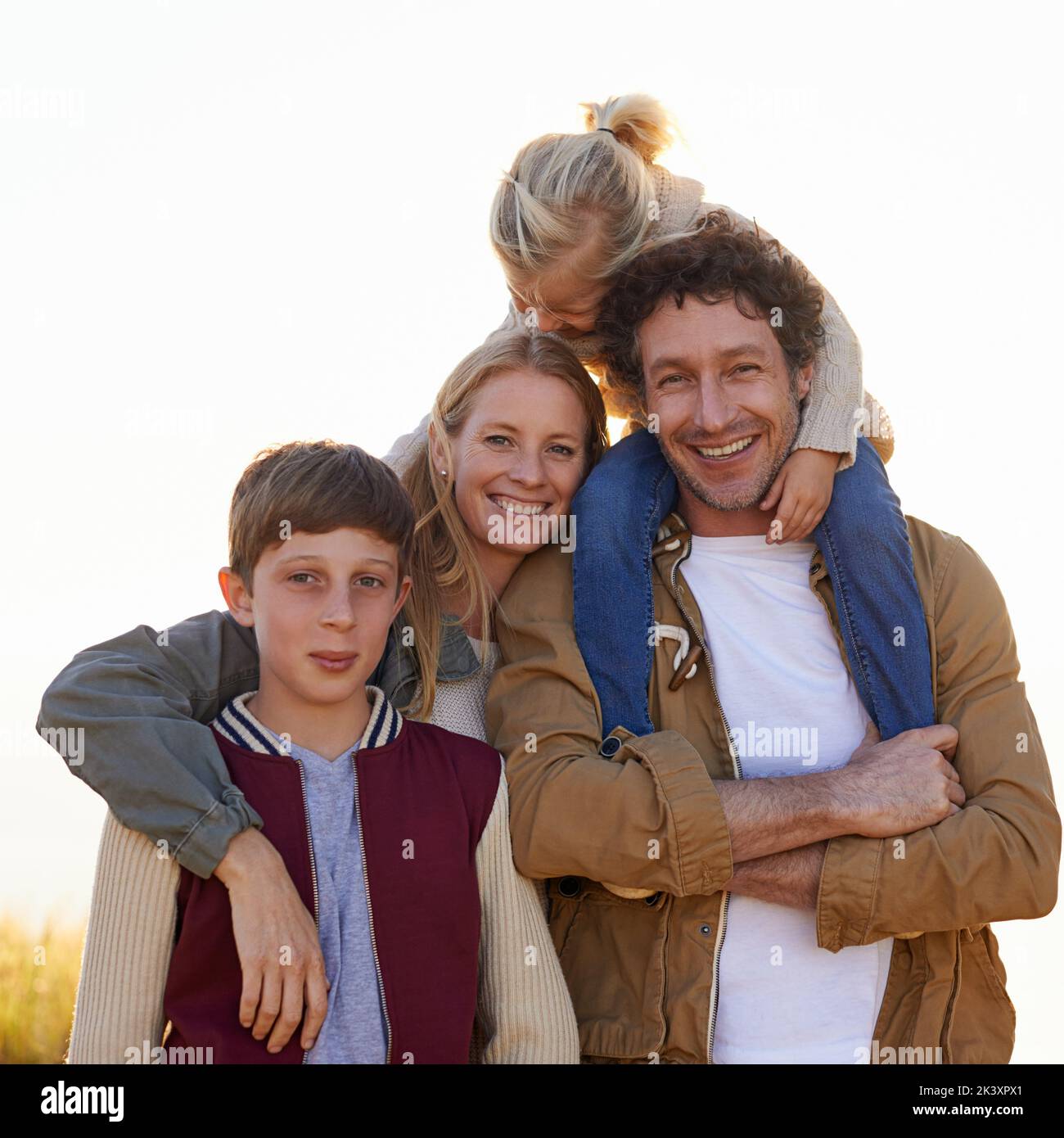 Making time for family. Cropped portrait of a loving family standing ...