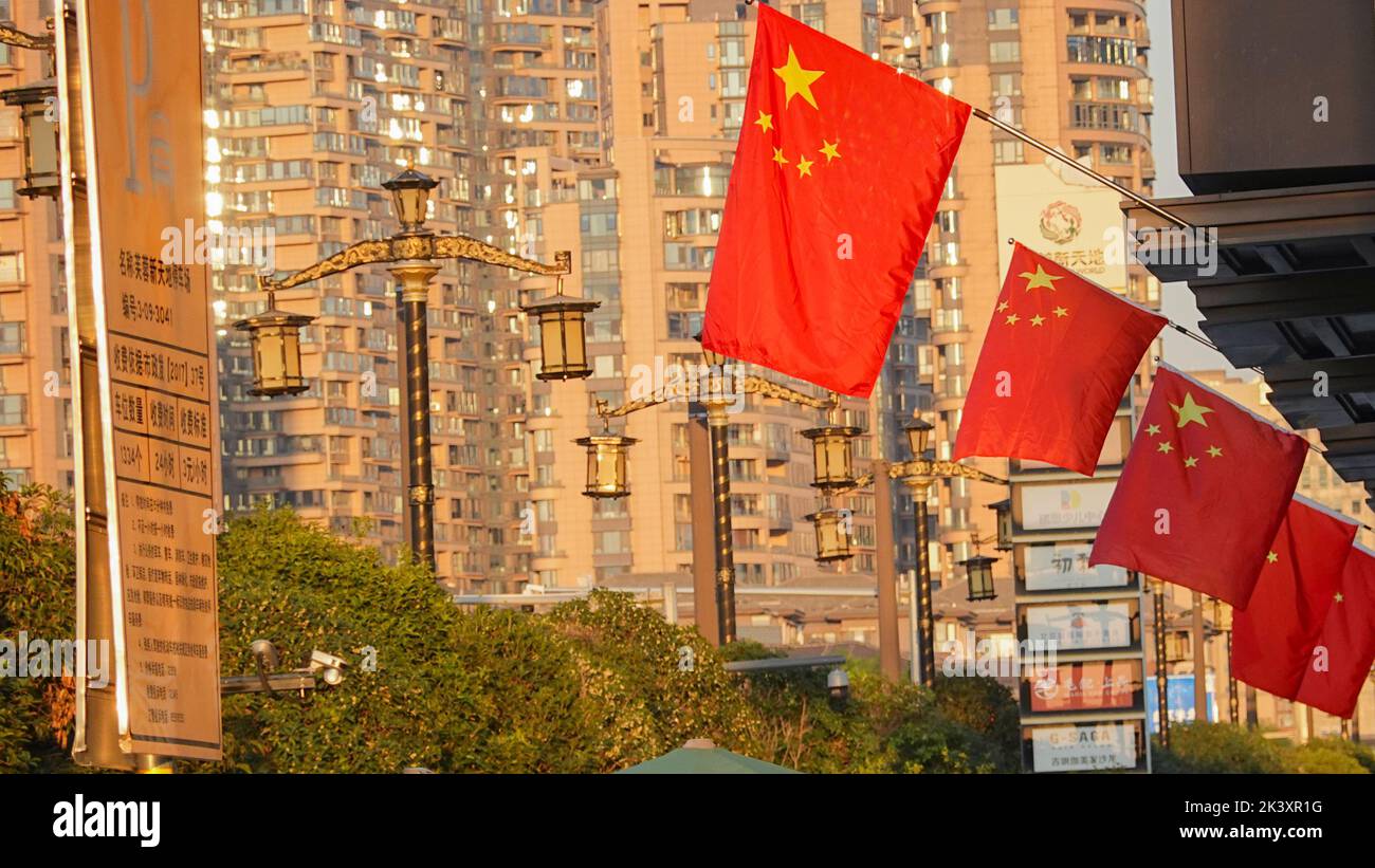 XI'AN, CHINA - SEPTEMBER 28, 2022 - National flags fly on a street in ...