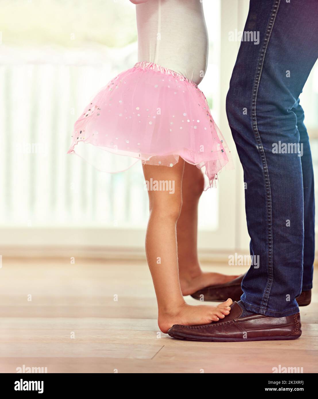 Dancing with her daddy. a father and daughter dancing Stock Photo - Alamy