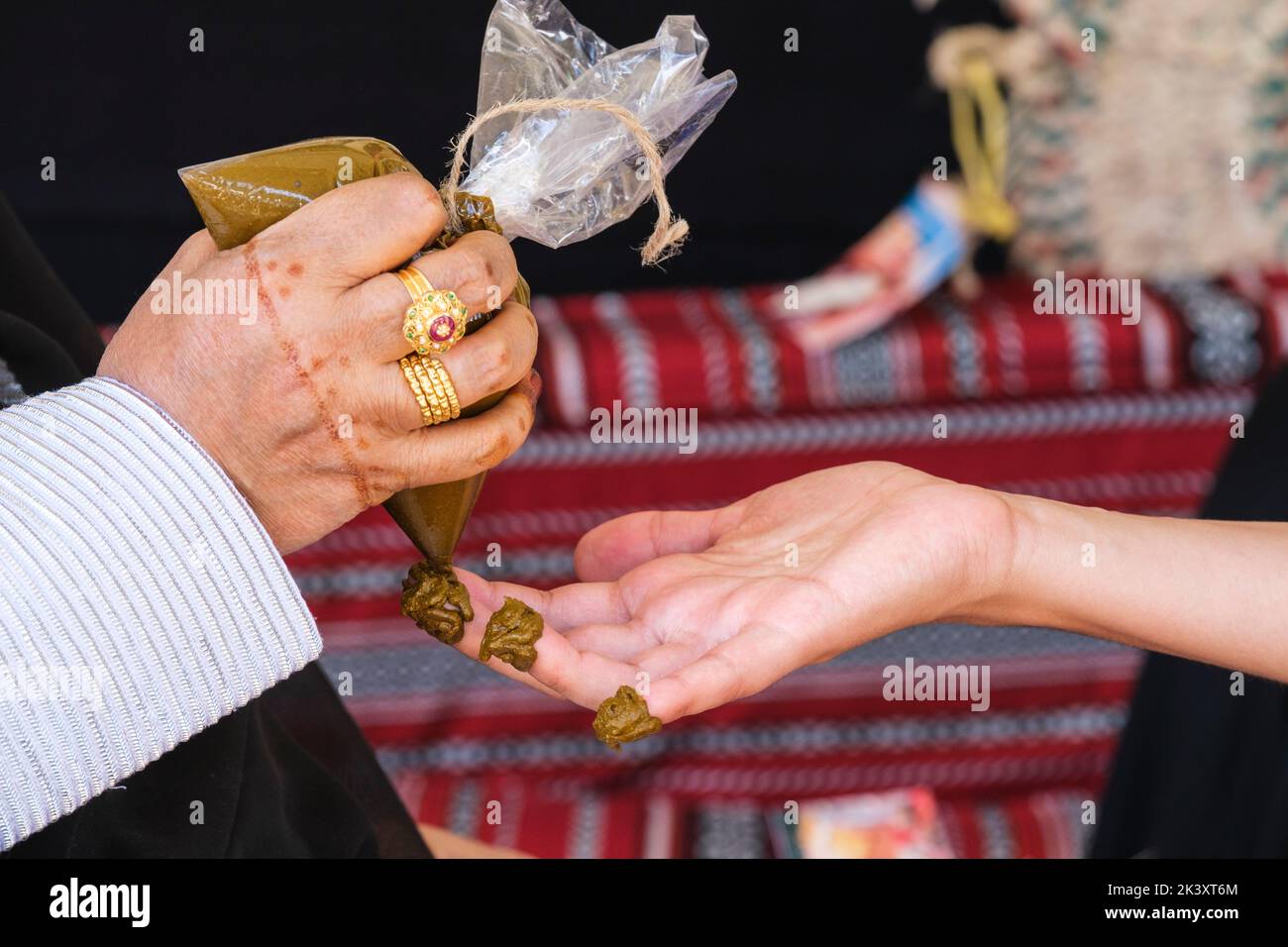 United Arab Emirates. Applying a Henna Design to the Fingernails. Note ...