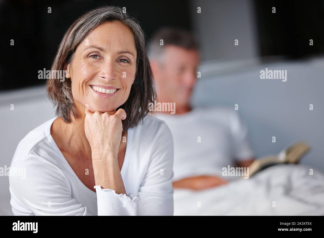 Feeling Refreshed Portrait Of An Attractive Mature Woman Sitting On Her Bed With Her Husband In