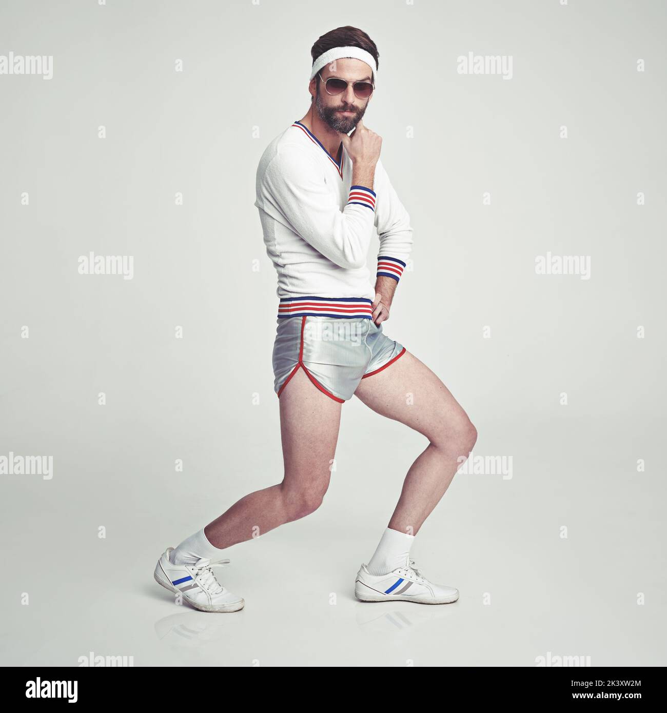 How you doing. A young man in the studio wearing retro sportswear and ...