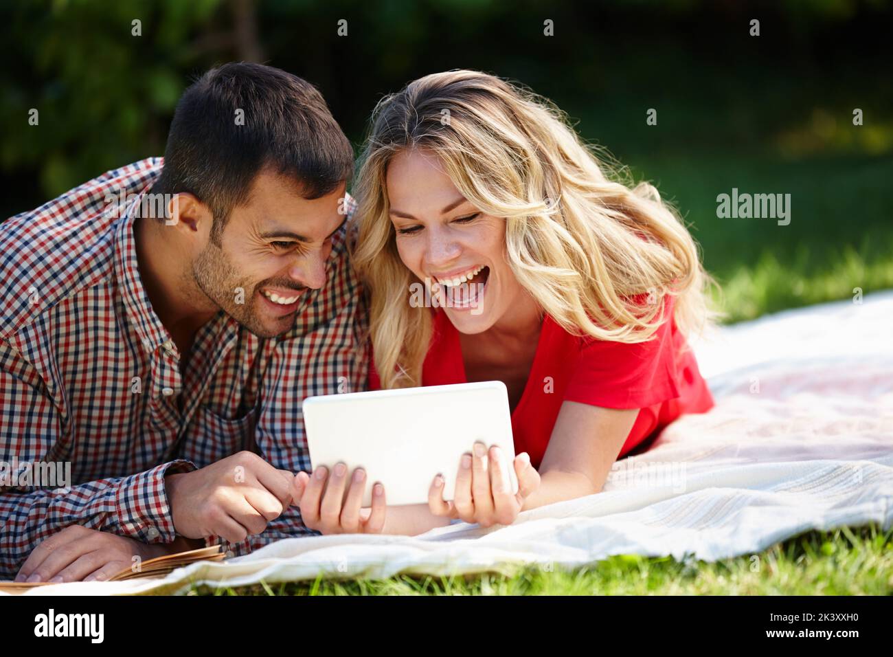 Playing tablet man in park hi-res stock photography and images - Alamy