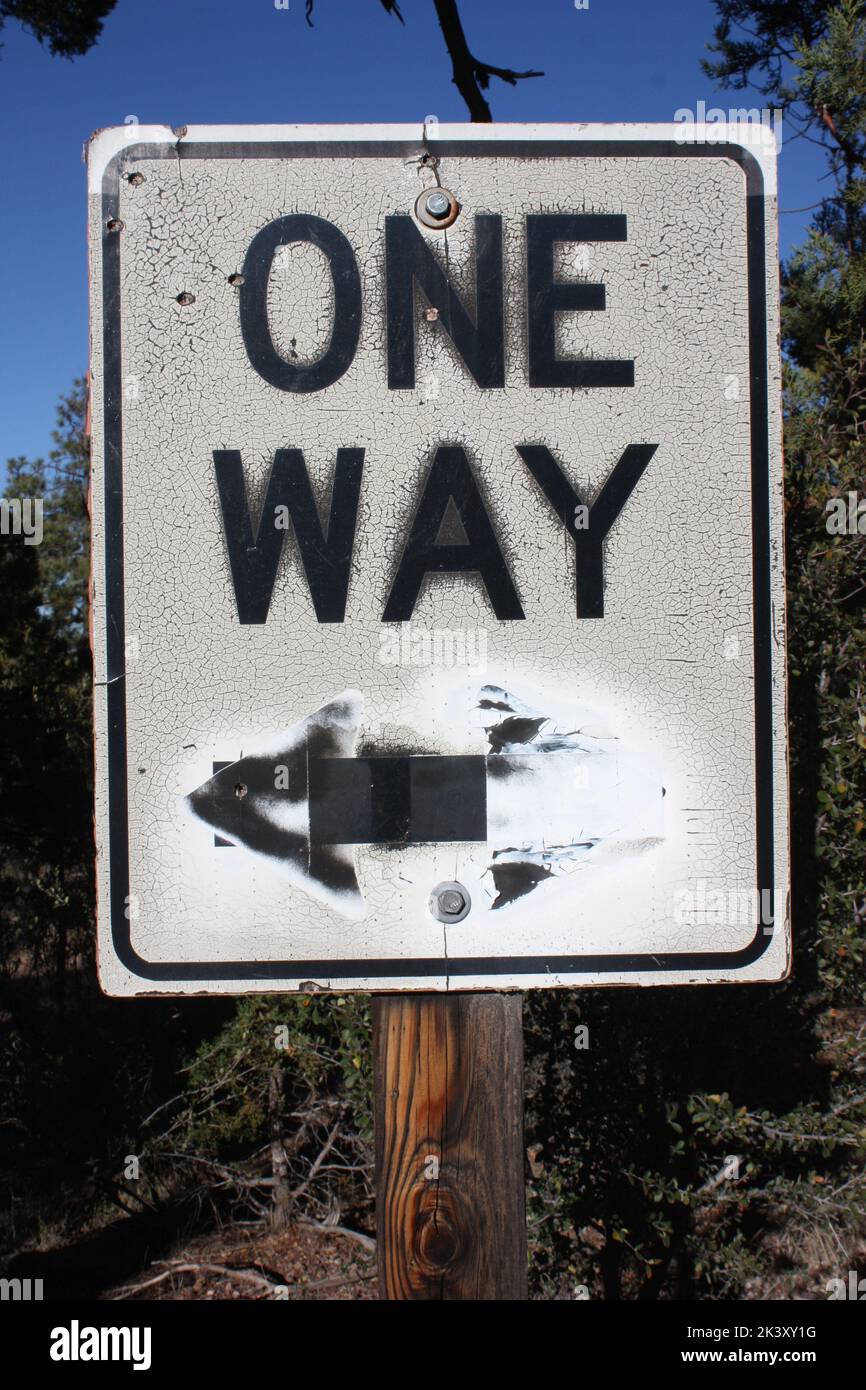 Old one-way sign that doesn’t know exactly which way to go Stock Photo ...