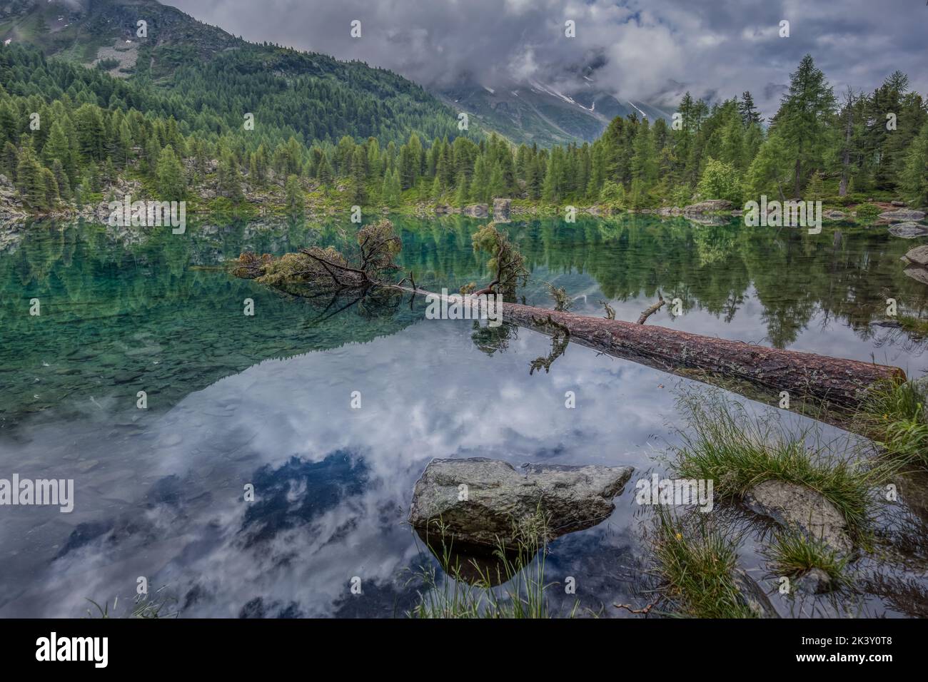 deep blue lake in the Val da Camp valley near Poschiavo, switzerland ...