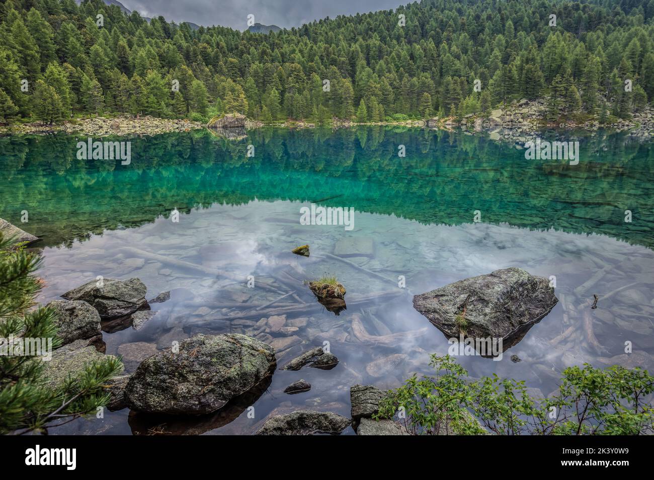 deep blue lake in the Val da Camp valley near Poschiavo, switzerland ...