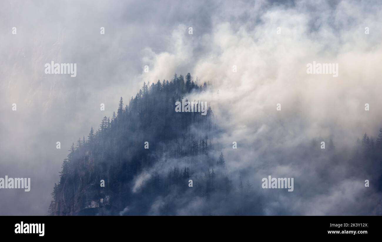 BC Forest Fire and Smoke over the mountain near Hope during a hot sunny ...