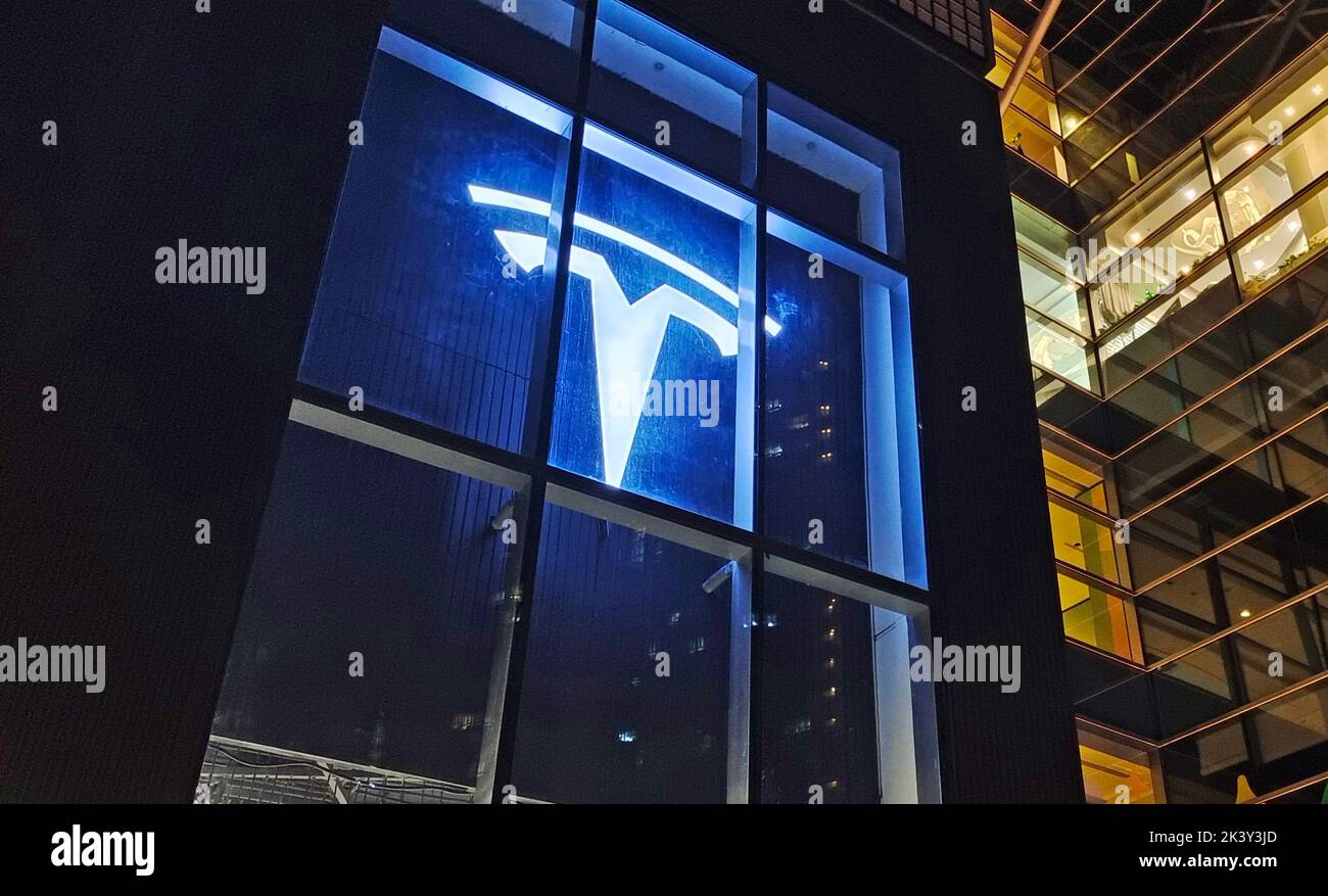 SHANGHAI, CHINA - SEPTEMBER 28, 2022 - A night view of a Tesla store ...