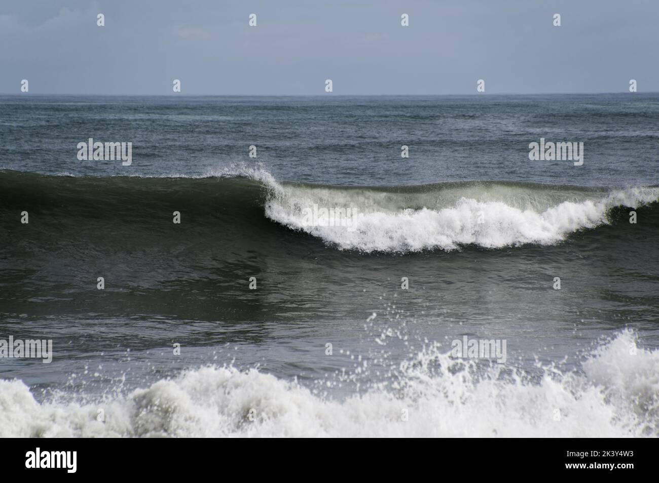 The wave face is still visible along part of the wave. The crest is ...