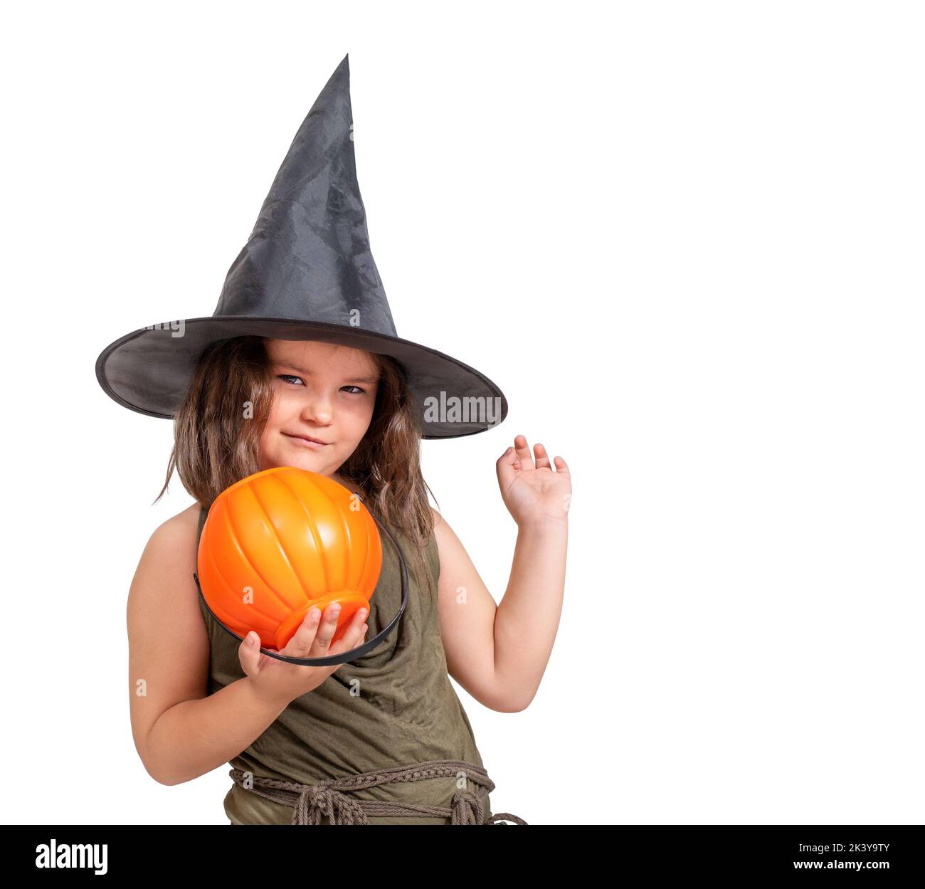 Halloween portrait of child in witch hat with sweets bucket isolated on white background Stock ...
