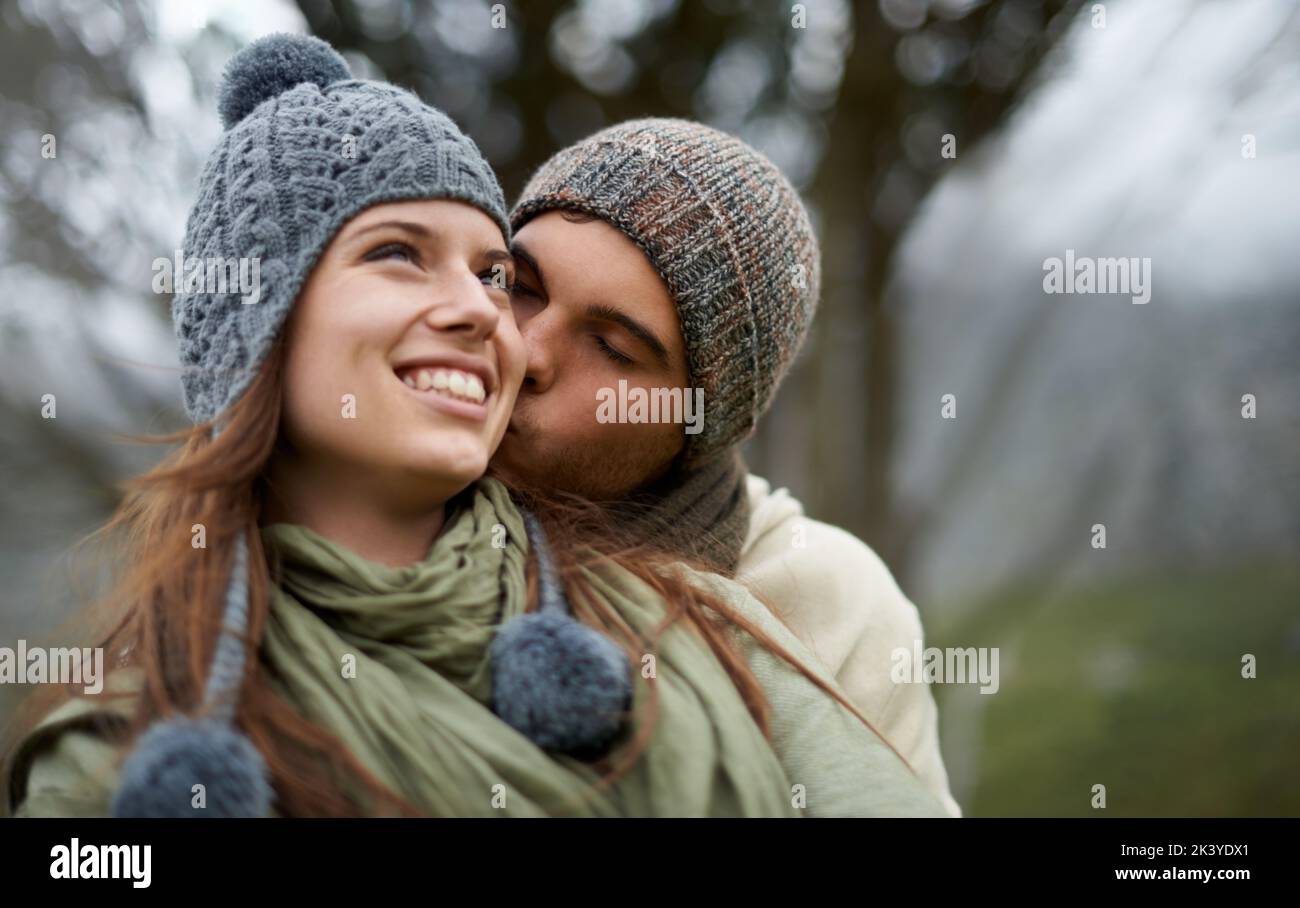 Growing closer to each other in nature. A young couple being ...