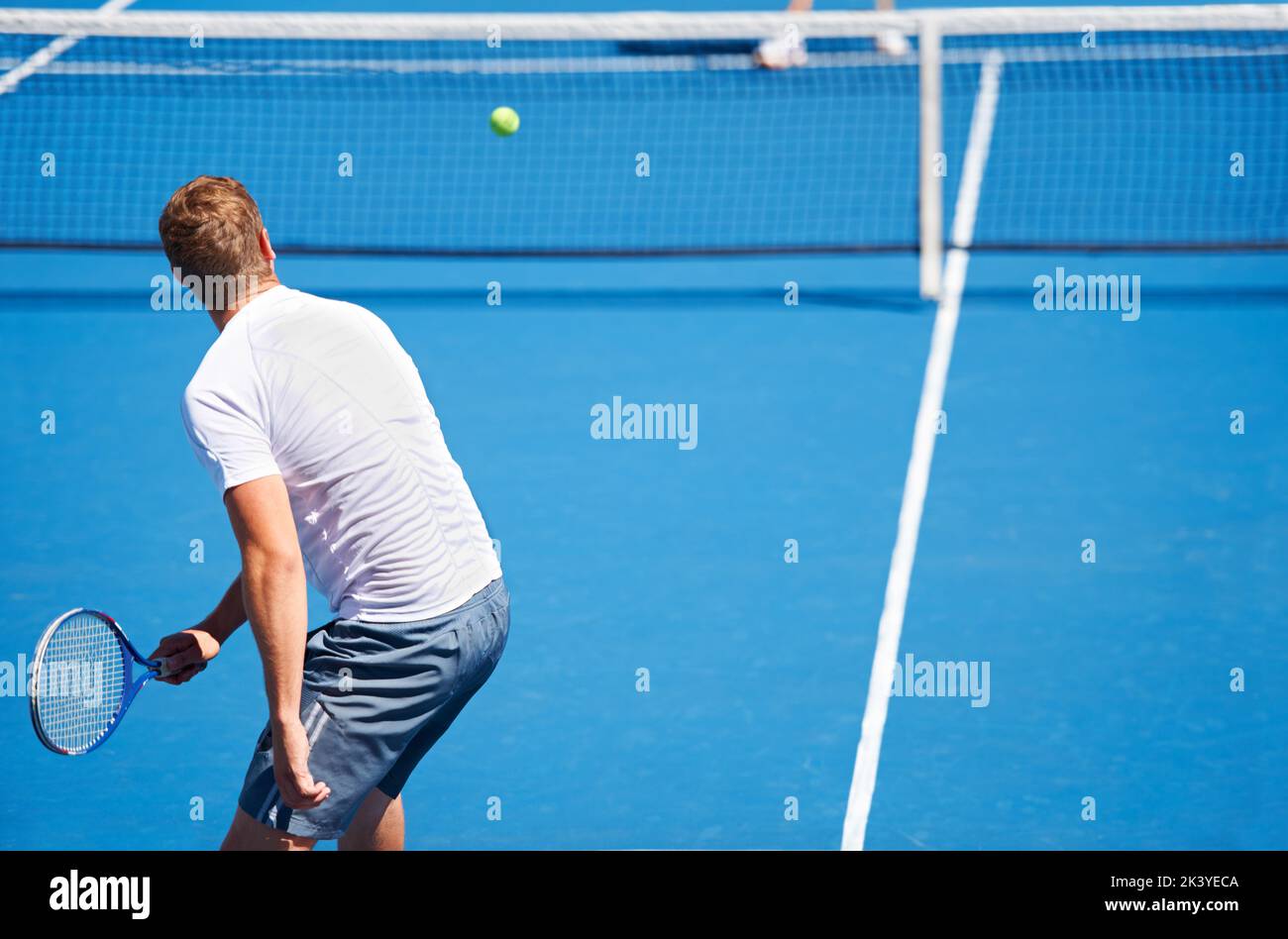 Showing up to every tennis practice. two people playing tennis outside ...