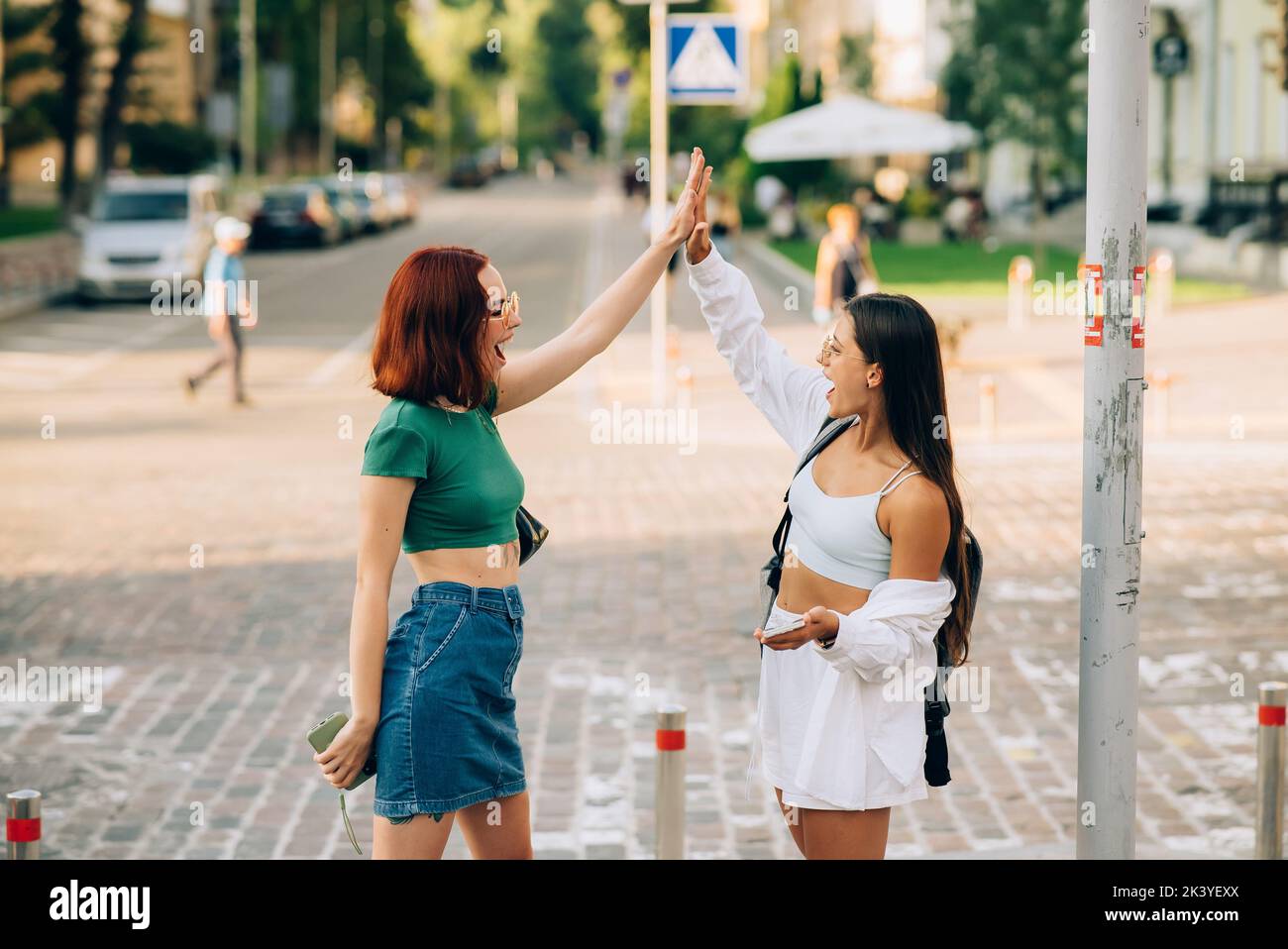 Girls high five outdoors hi-res stock photography and images - Alamy
