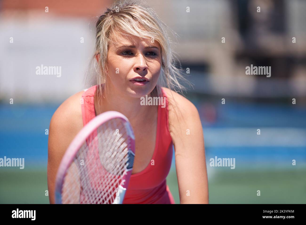 Shes going to be a tennis star. A young tennis athlete in the middle of ...