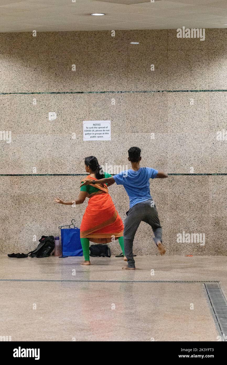A vertical rear view of a couple practicing dance on Esplanade ...