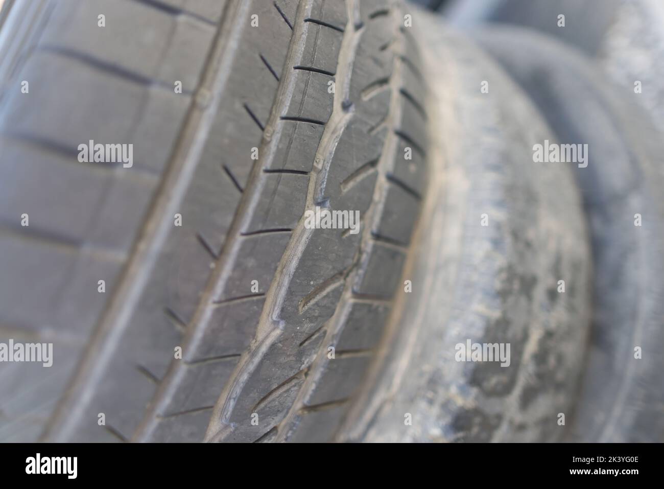 Old damaged and worn black tire thread Stock Photo - Alamy