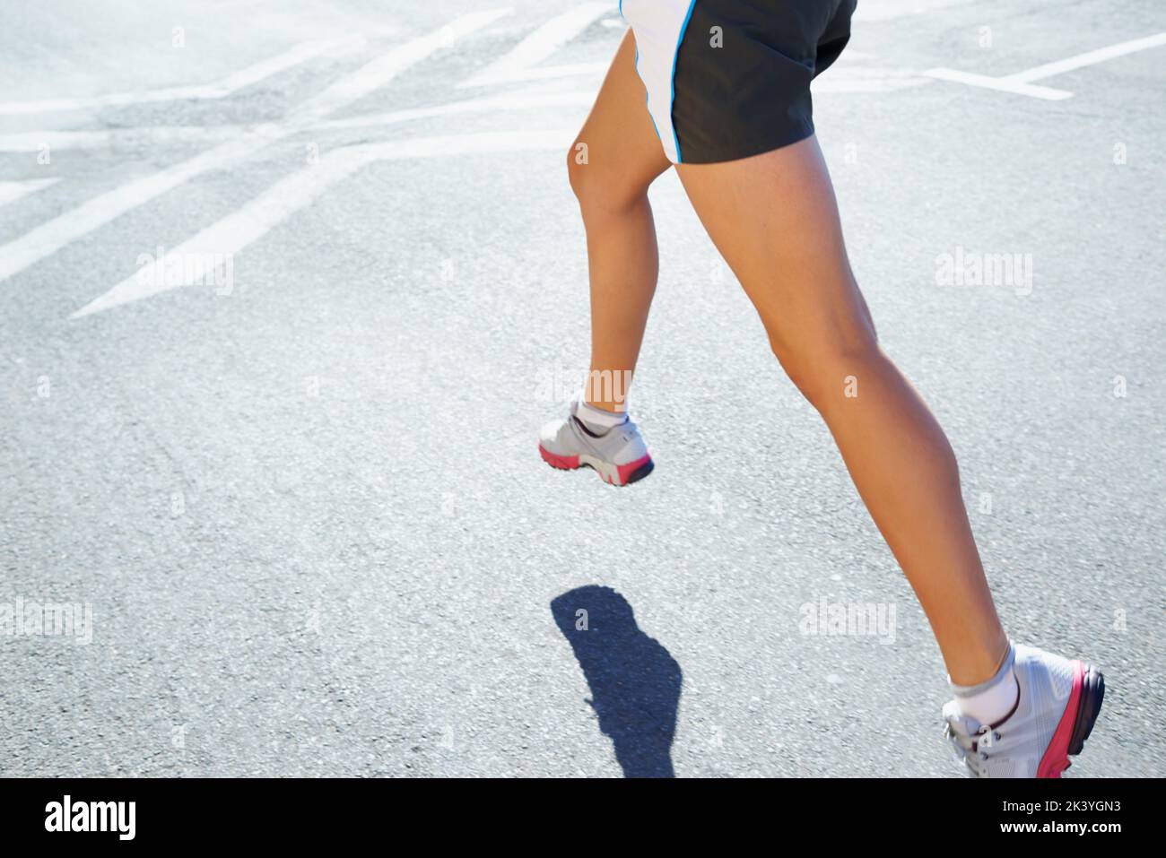Getting fit one step at a time. an athletic young woman running ...