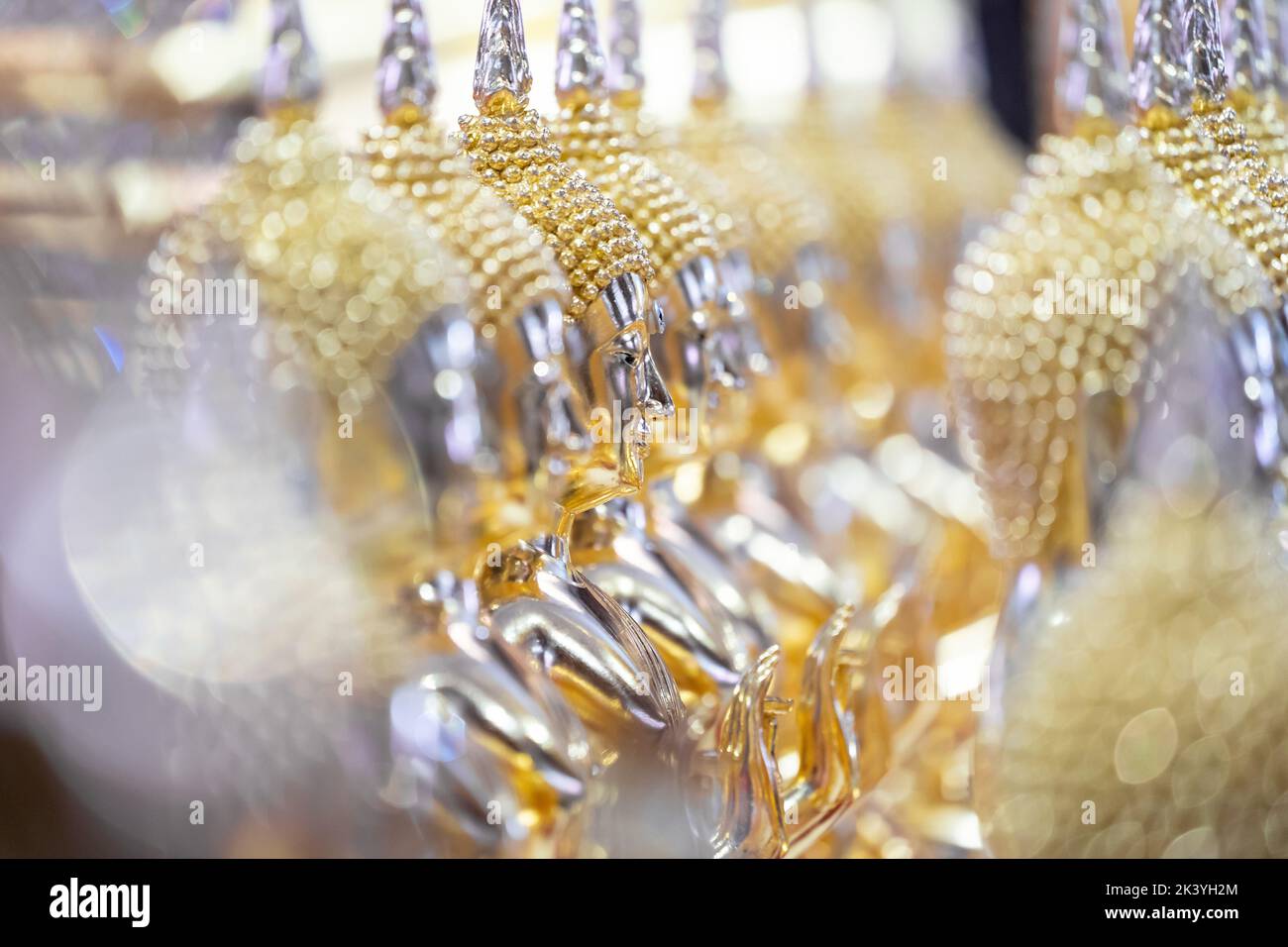 Close up to the Asia antique brightness and glitter Buddha statue ...