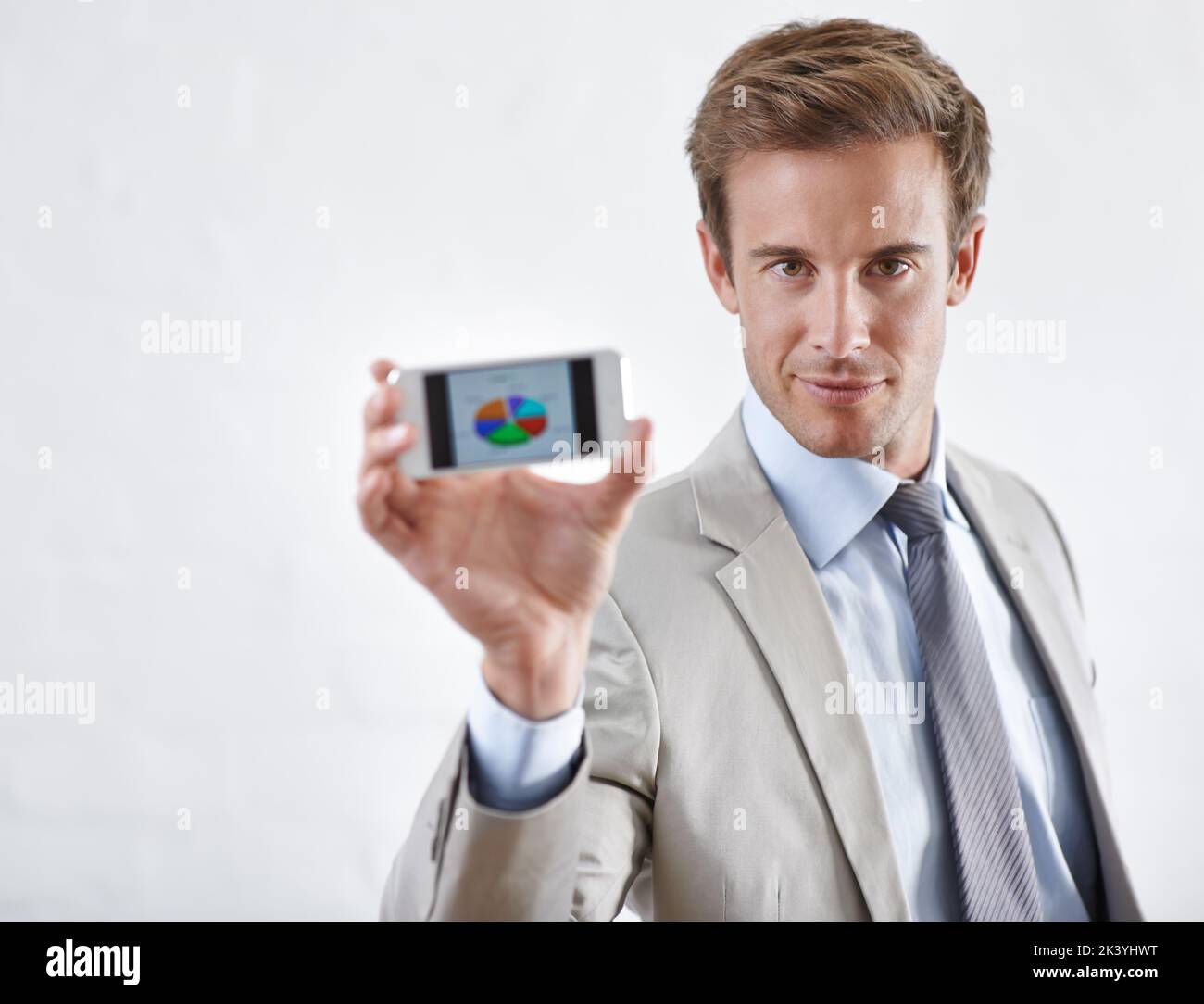Young businessman working financial charts hi-res stock photography and images - Alamy