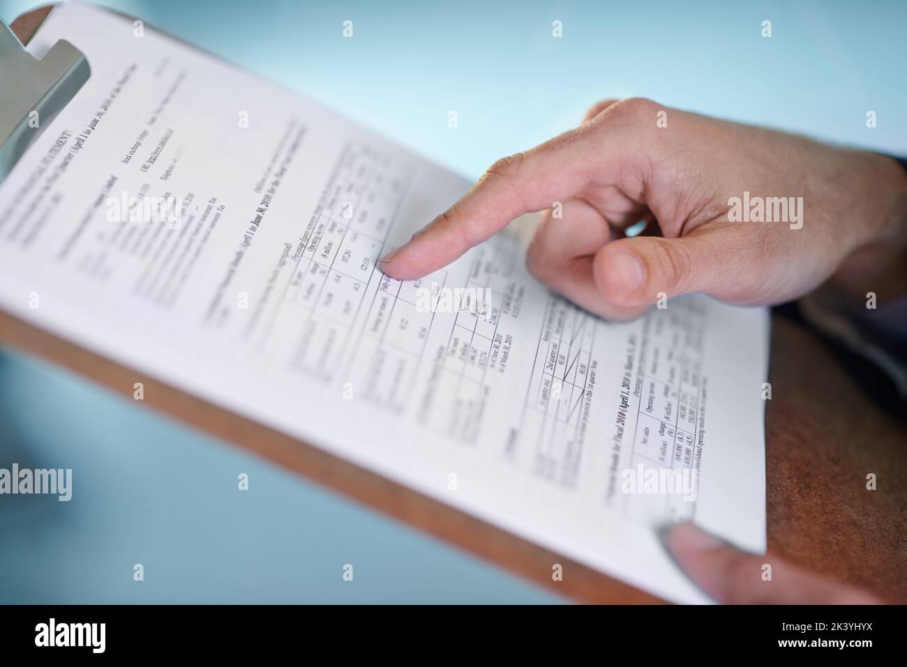 Reviewing the companys income. Cropped image of a businessman pointing ...