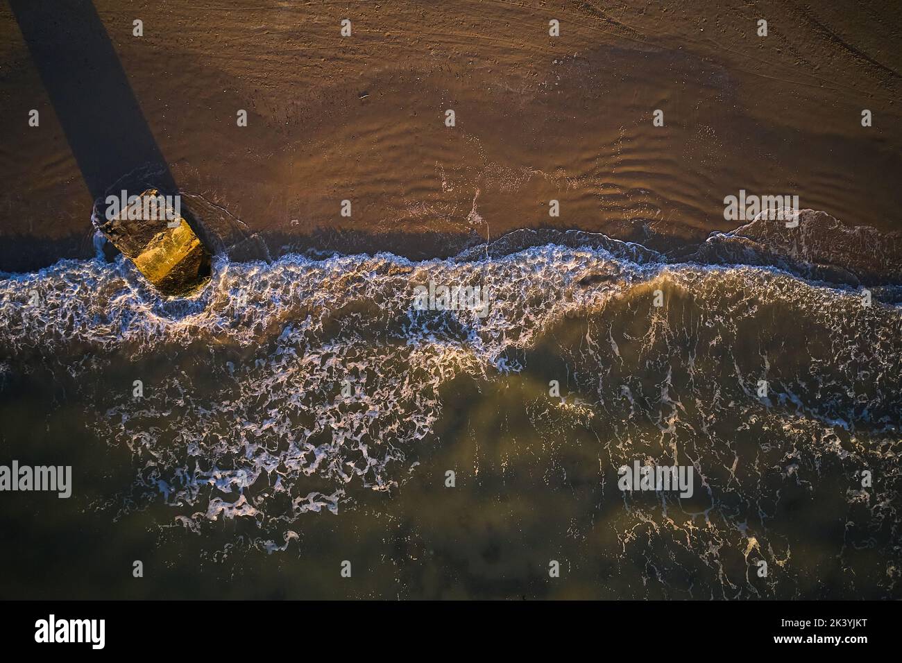 Beach in Løkken Denmark with strong waves Stock Photo - Alamy