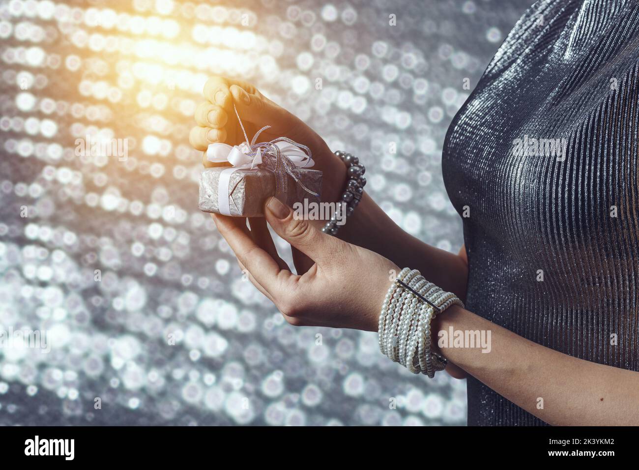 Closeup hands giving surprise gift box Stock Photo - Alamy