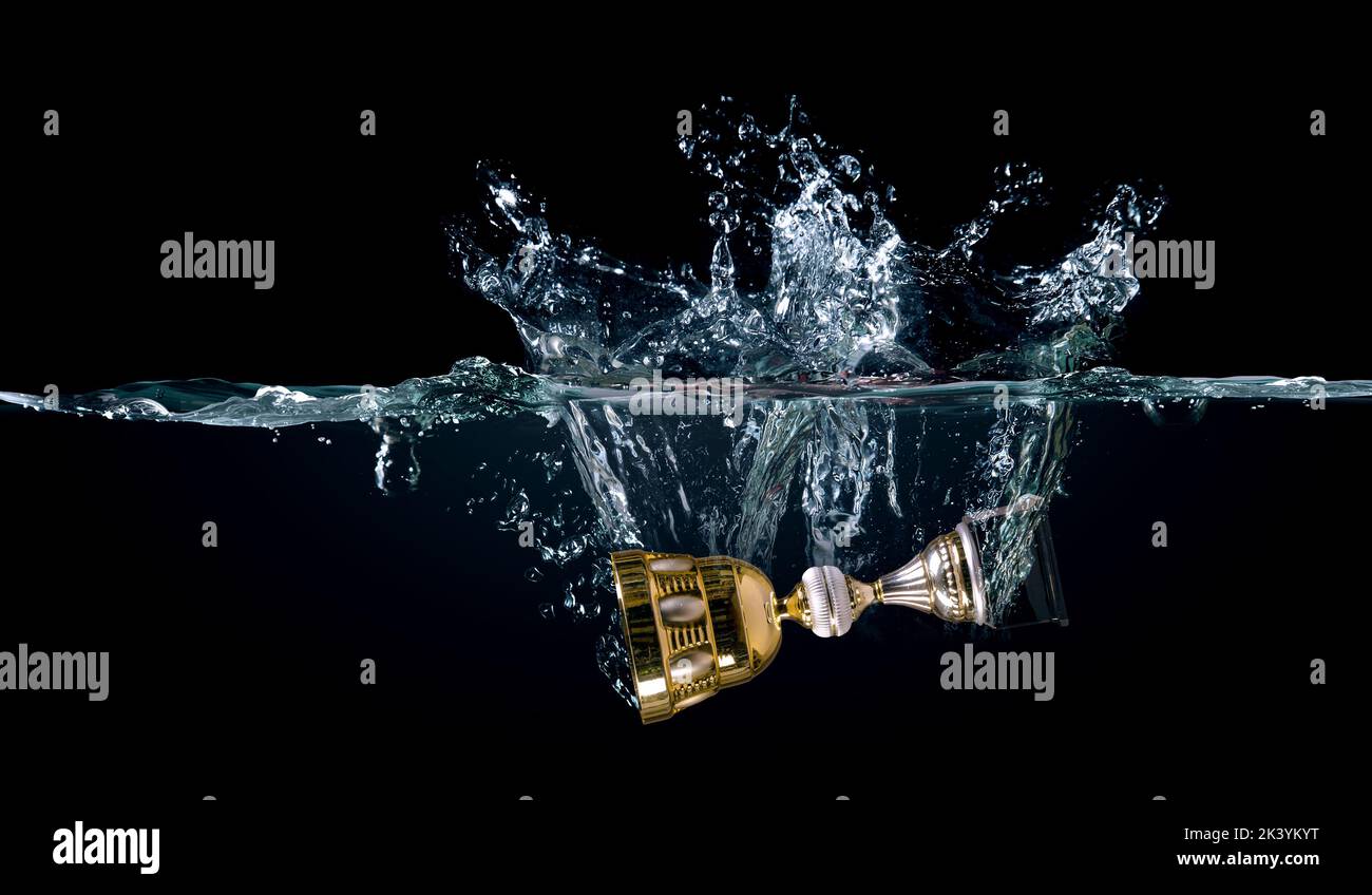 Trophey cup in water mixed media hi-res stock photography and images ...