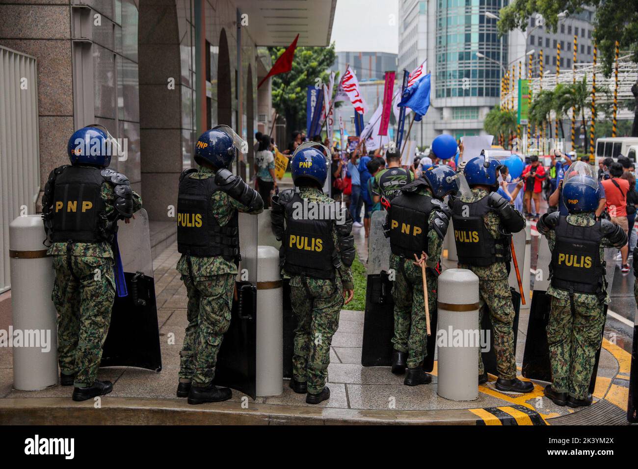 Manila, Philippines. 29th Sep, 2022. Anti-riot police stand in formation as climate activists ...