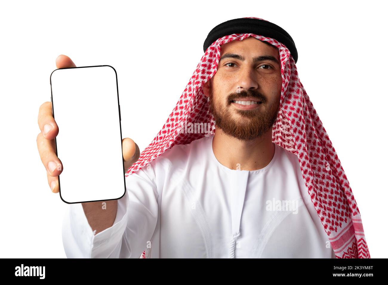 Young Arab muslim man in traditional clothes showing mobile phone ...