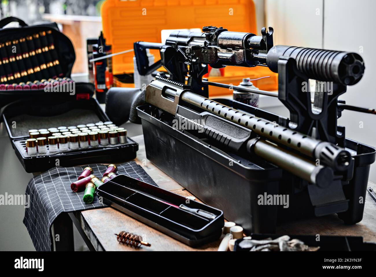 Shotgun rifle with cartridges on table in a weapon workshop Stock Photo ...