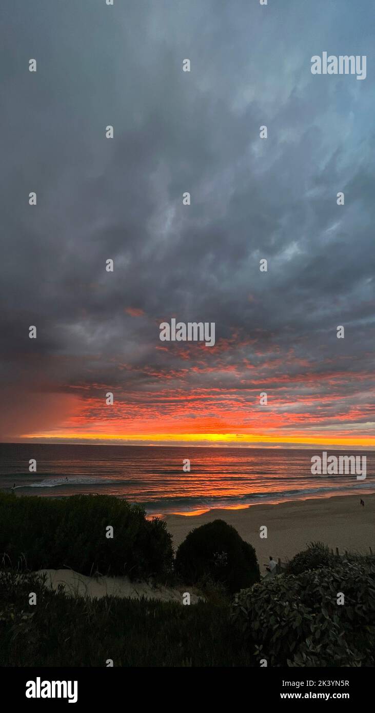 A mesmerizing view of a beautiful seascape at scenic sunset Stock Photo ...