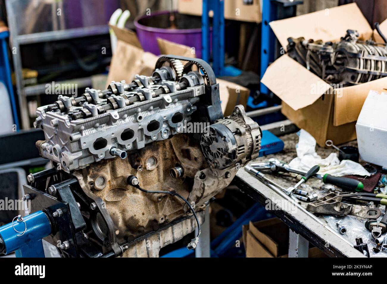 Disassembled car engine block at car service station Stock Photo - Alamy