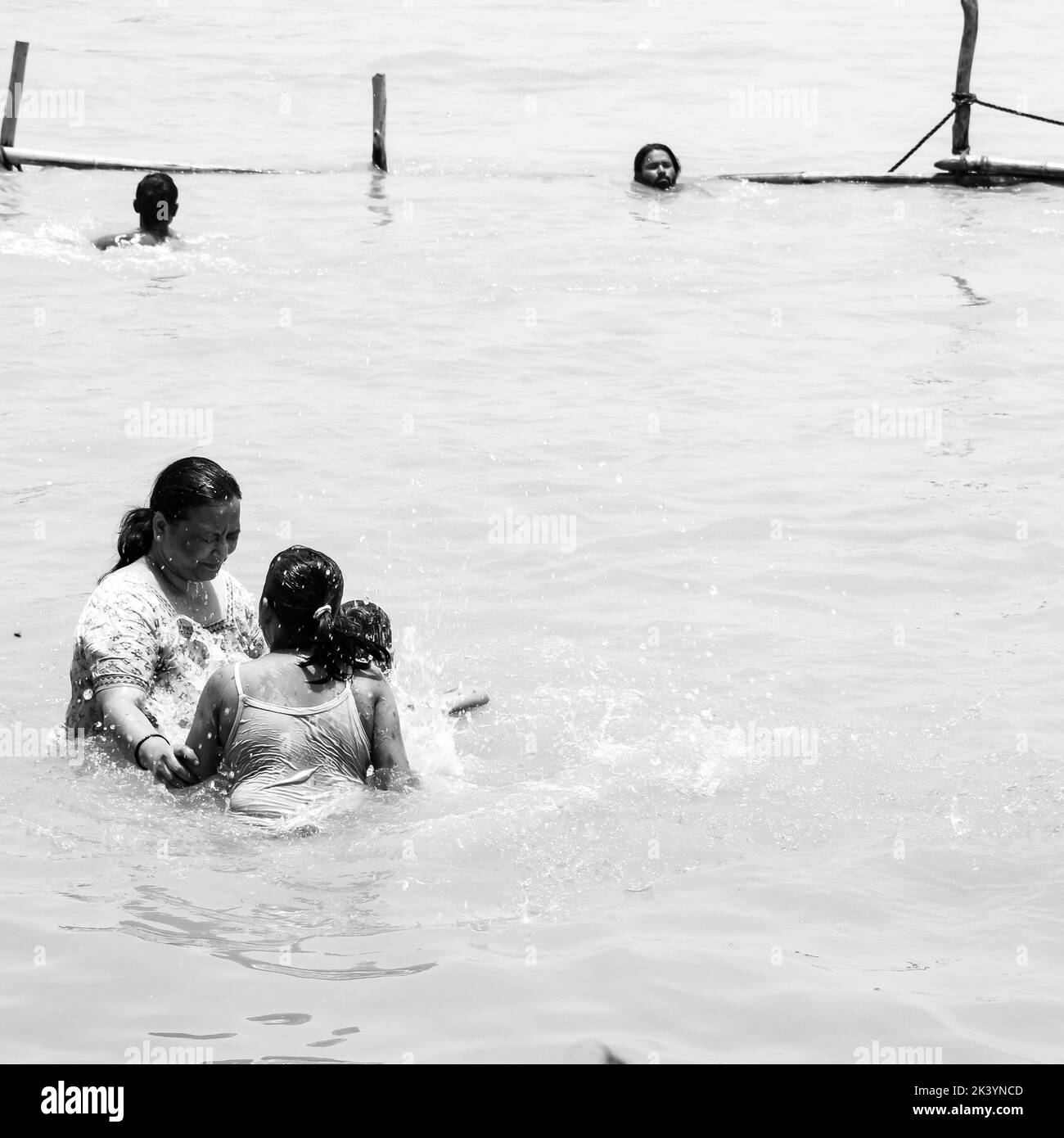 Taking dip in ganga Black and White Stock Photos & Images - Alamy