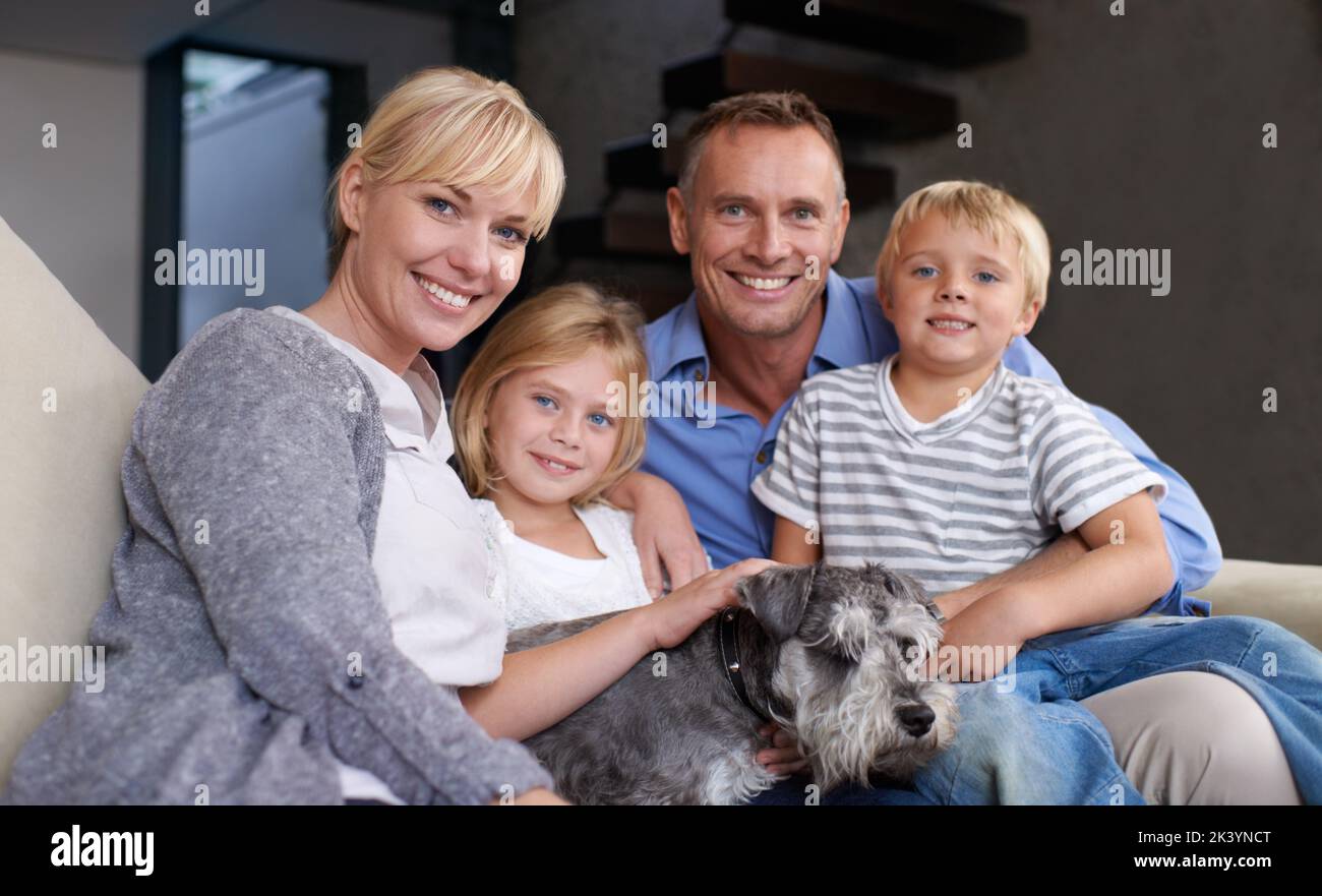 Theyre such a content family. A happy family and their dog relaxing at ...