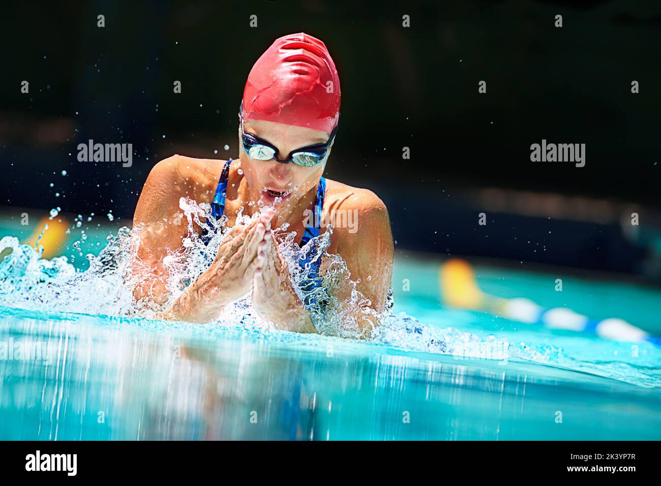 The hardest stroke in swimming...a young female swimmer doing the ...